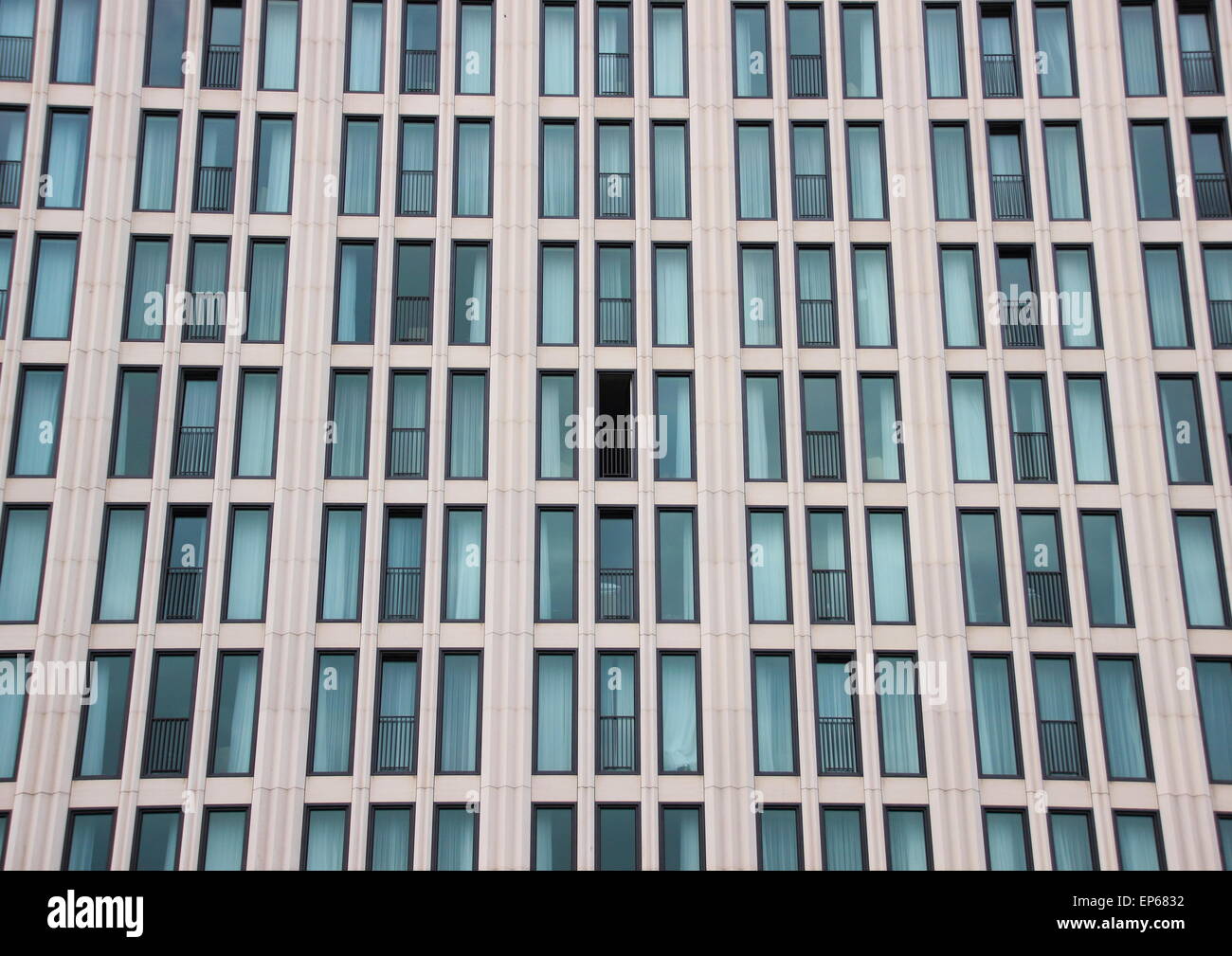 Modern building facade with one open window Stock Photo - Alamy