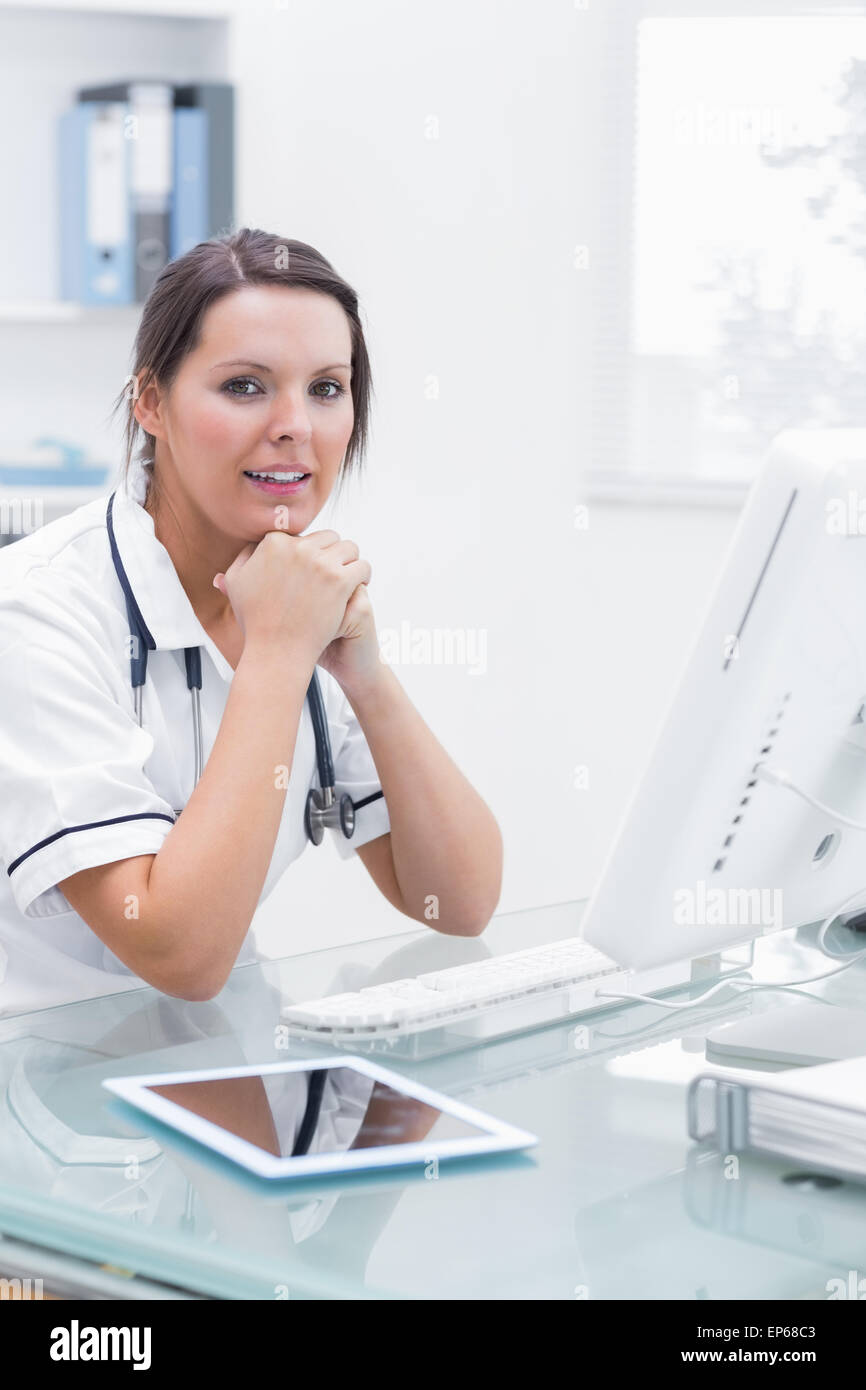 Nurse looking computer monitor in hi-res stock photography and images ...