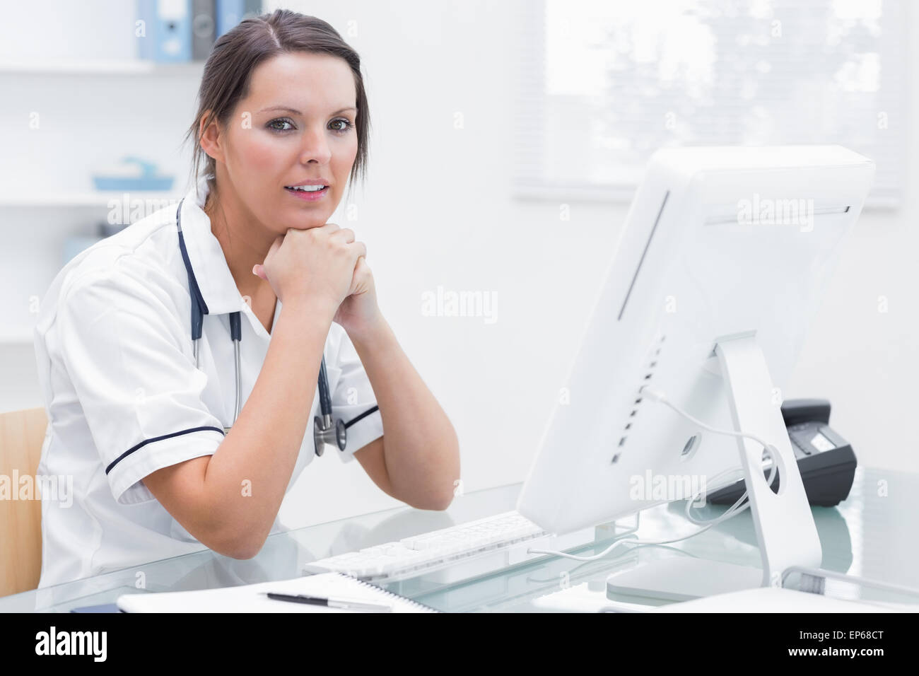 Nurse looking computer monitor in hi-res stock photography and images ...