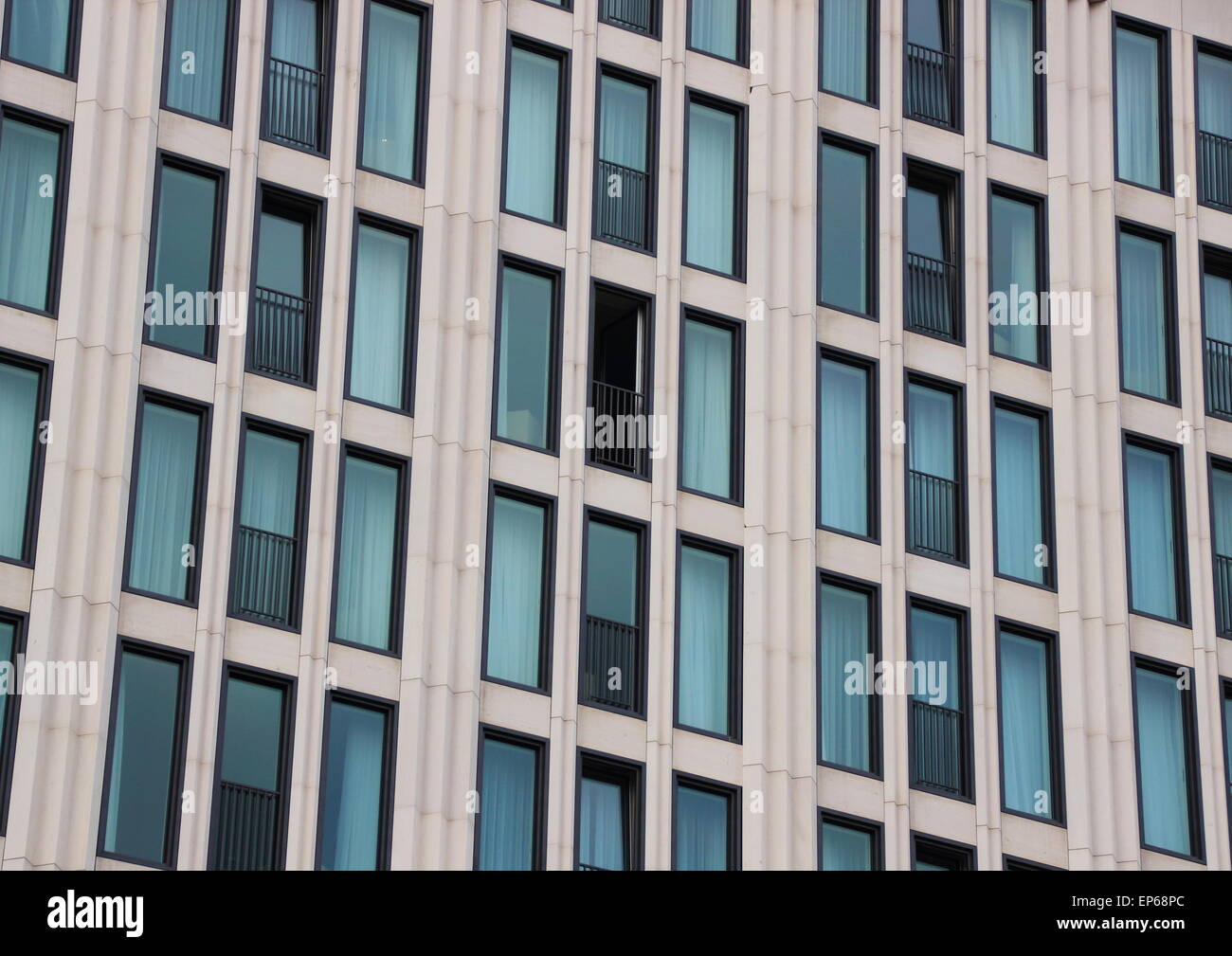 Perspective of building facade with one open window Stock Photo - Alamy
