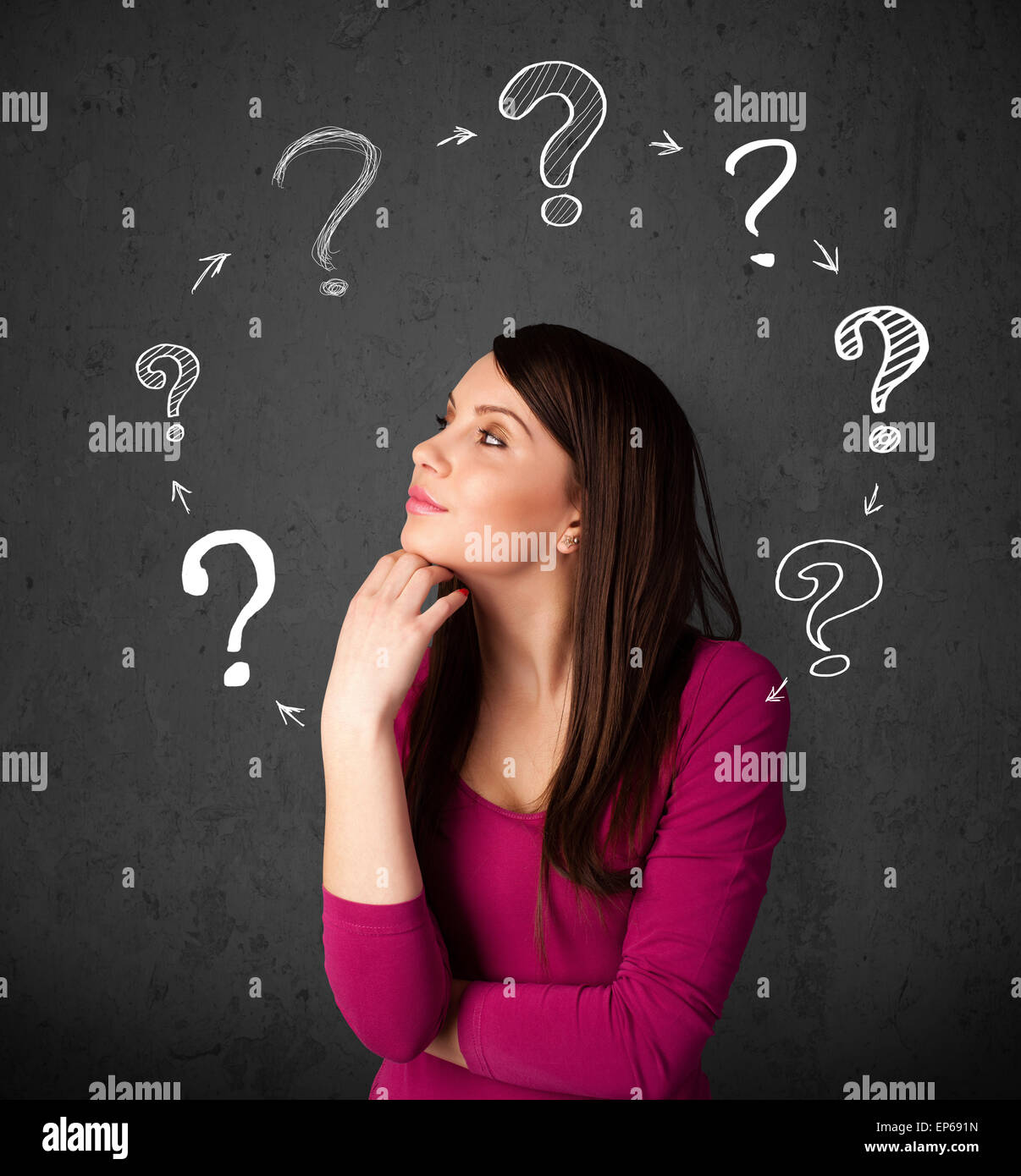 Young woman thinking with question mark circulation around her head ...