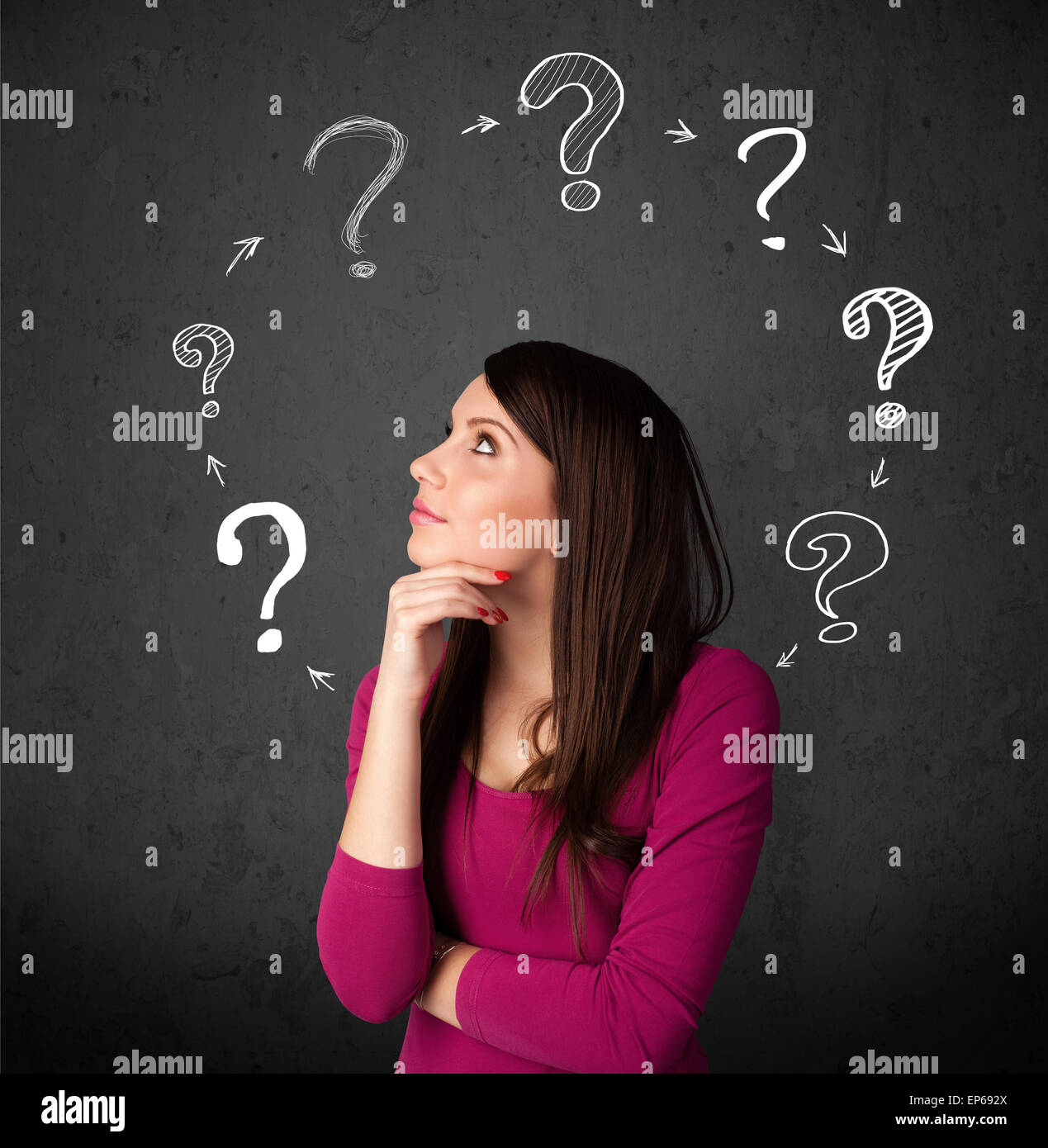 Young woman thinking with question mark circulation around her head ...