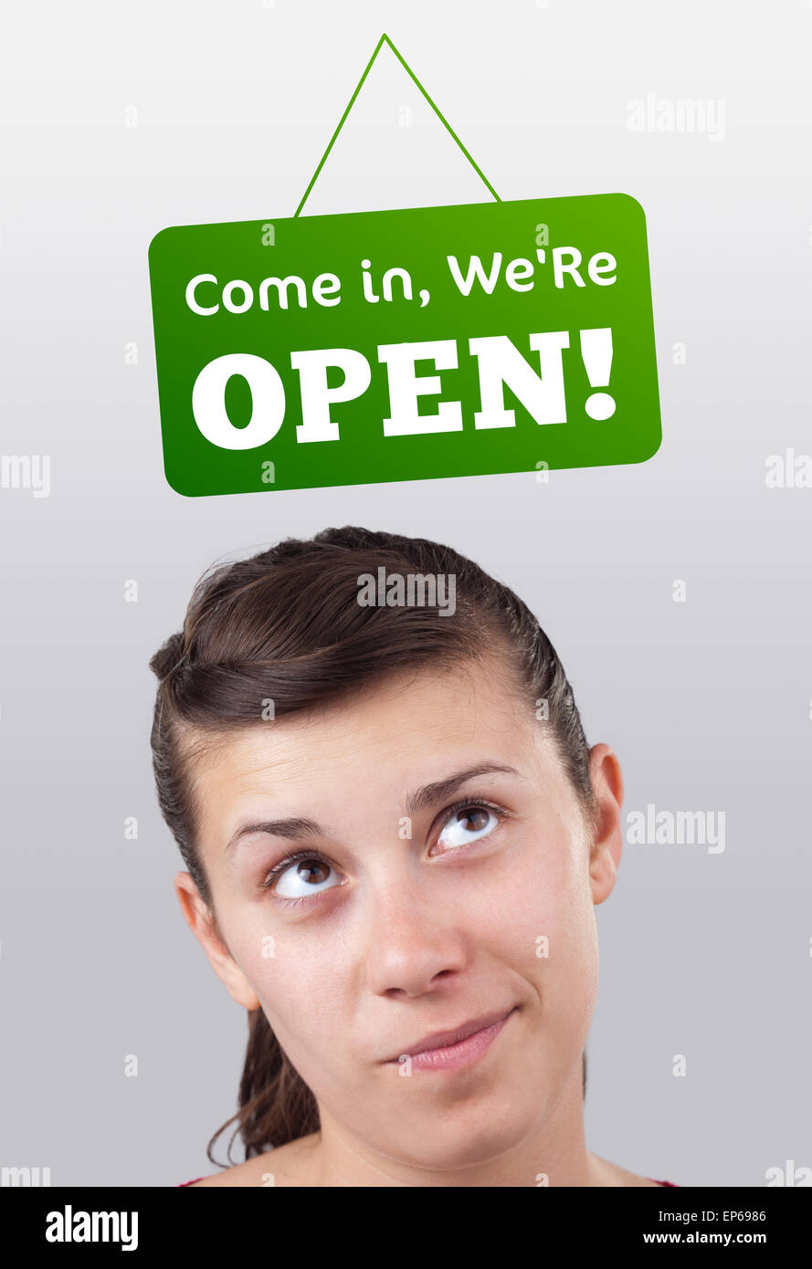 Young girl head looking at closed and open signs Stock Photo - Alamy