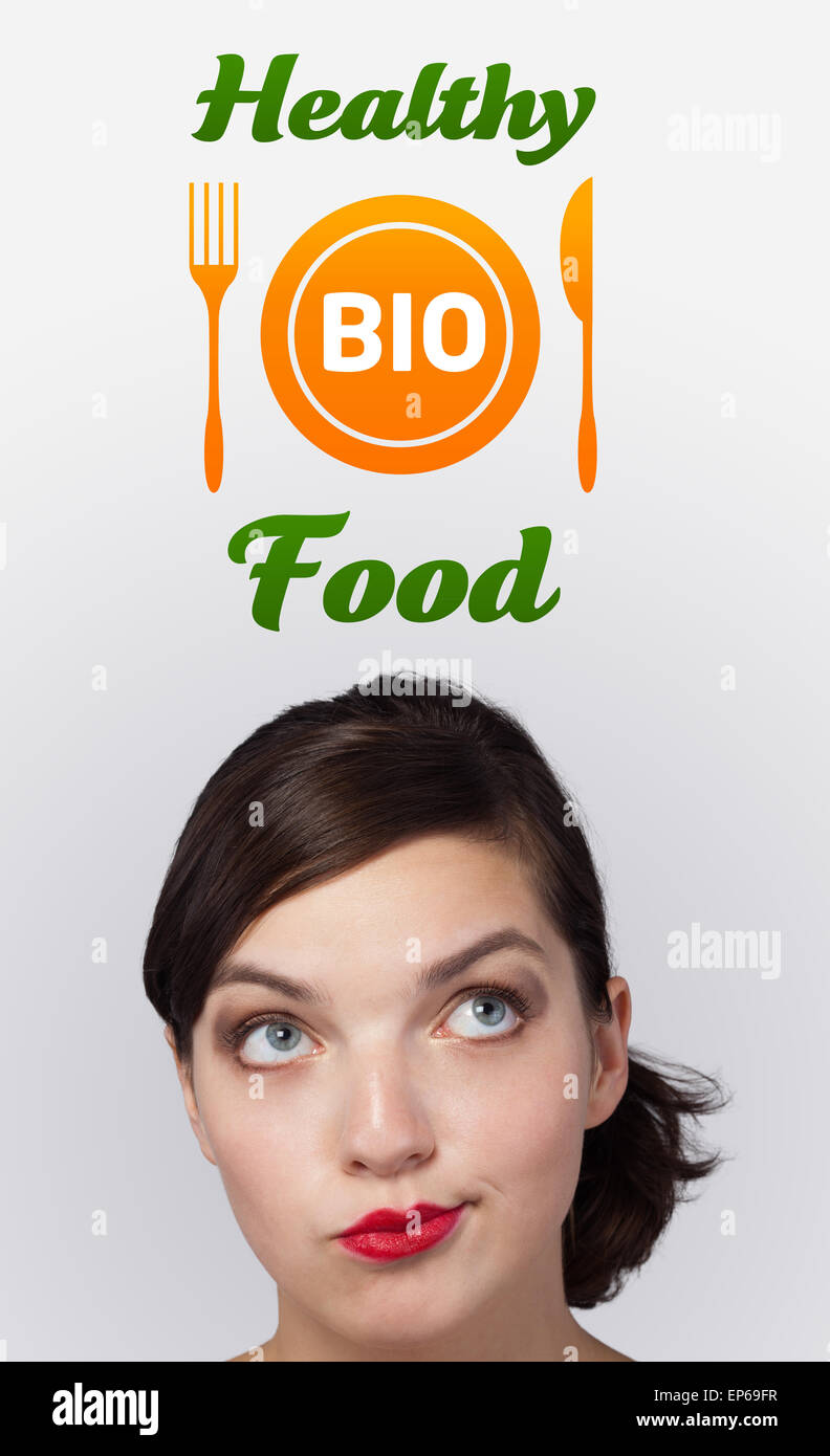 Young girl looking at healthy food sign Stock Photo - Alamy