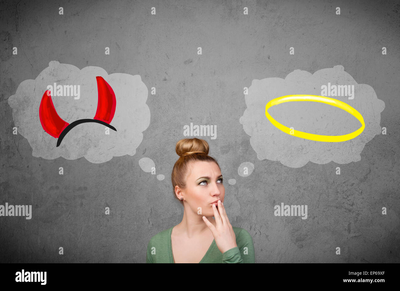 Woman choosing between good and bad Stock Photo - Alamy
