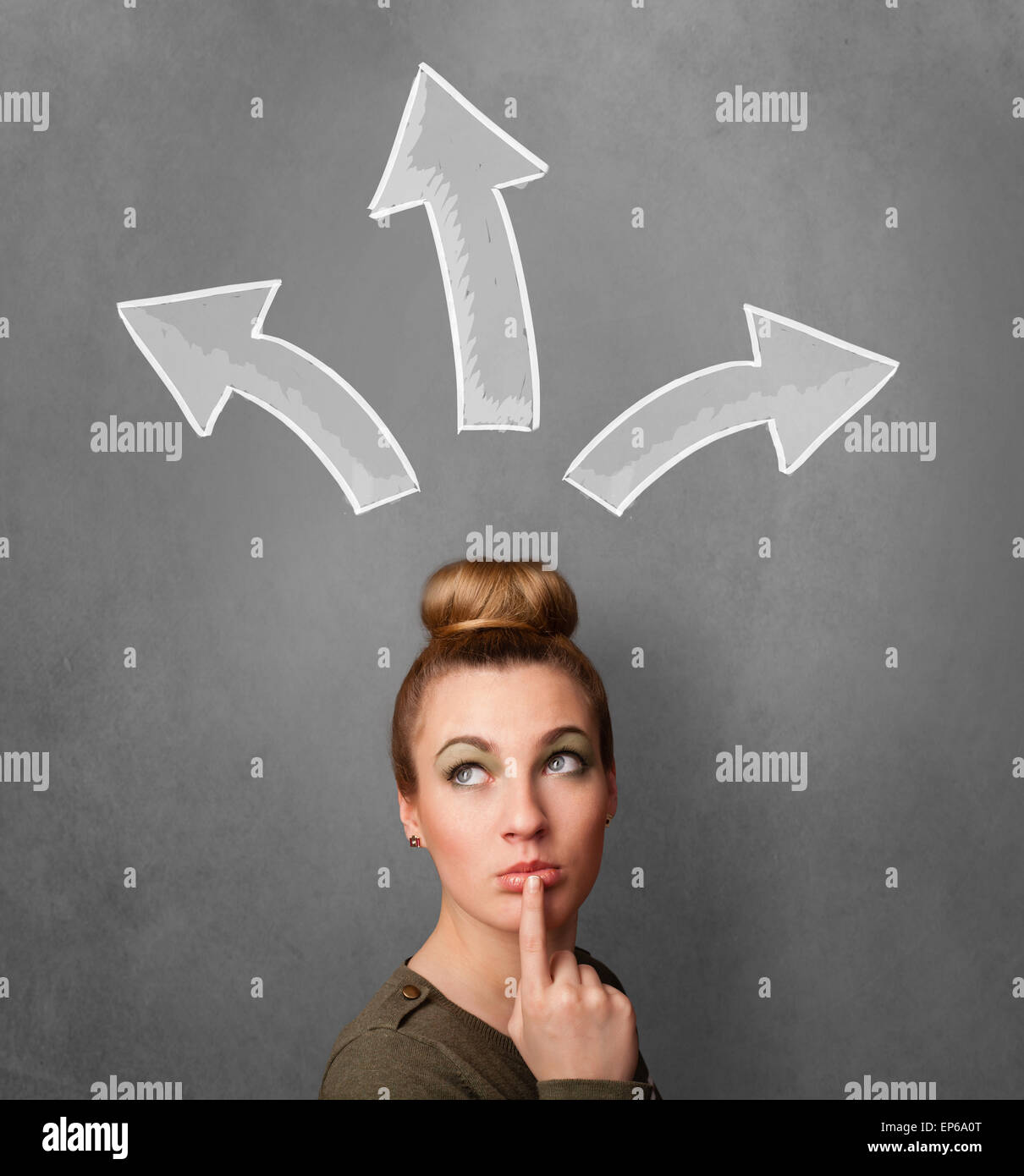 Young woman thinking with arrows above her head Stock Photo - Alamy