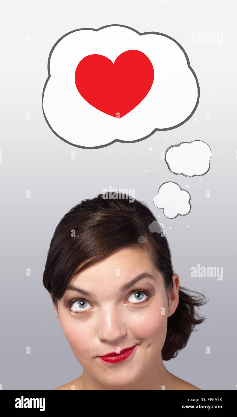 Young girl looking at love type of icons Stock Photo - Alamy