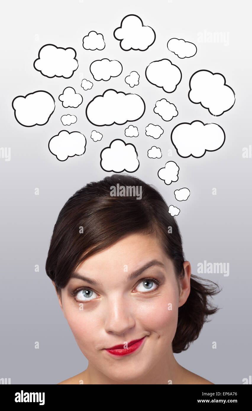 Young girl thinking with clouds Stock Photo - Alamy