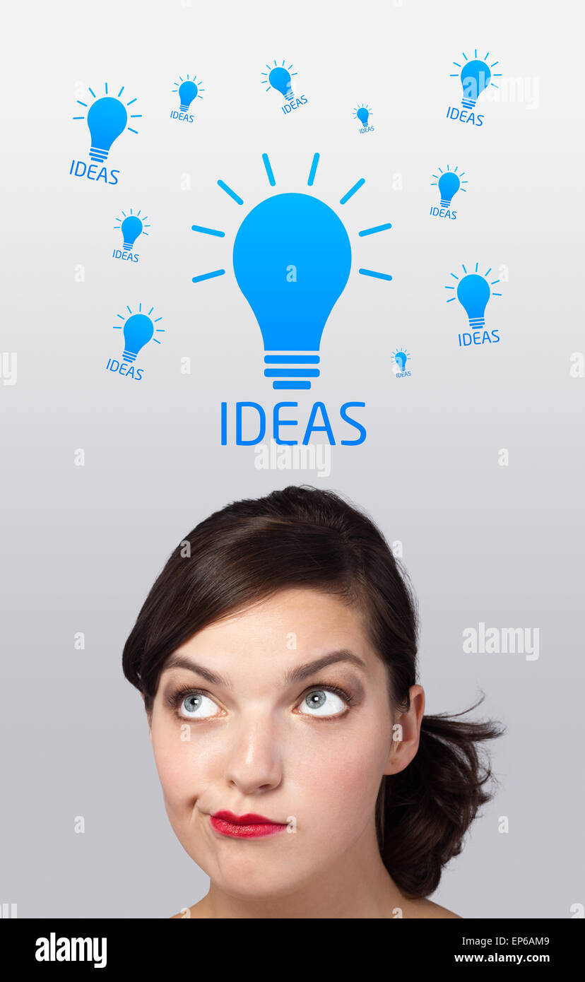 Young girl looking at idea type of sign Stock Photo - Alamy