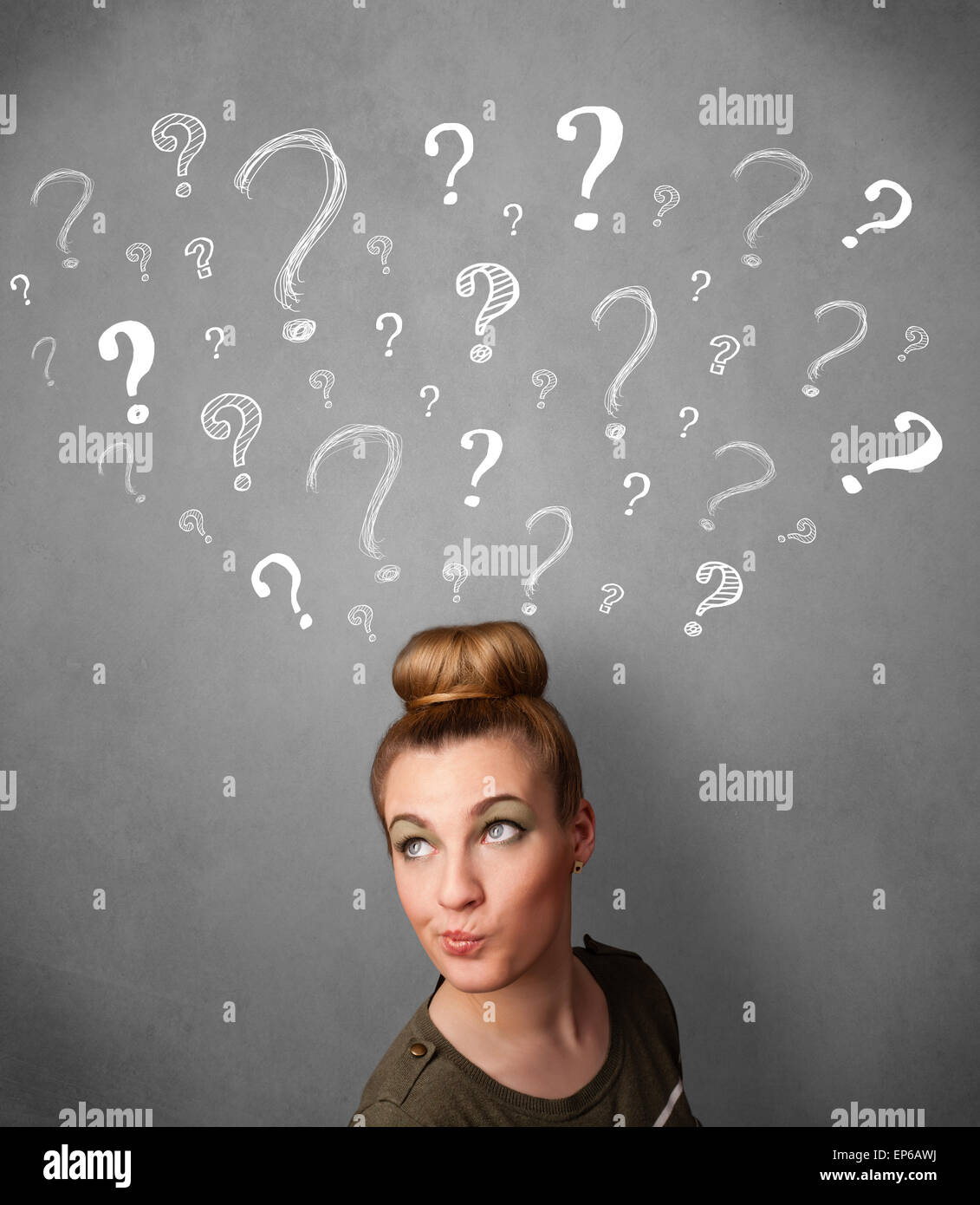 Young woman with question marks above her head Stock Photo - Alamy