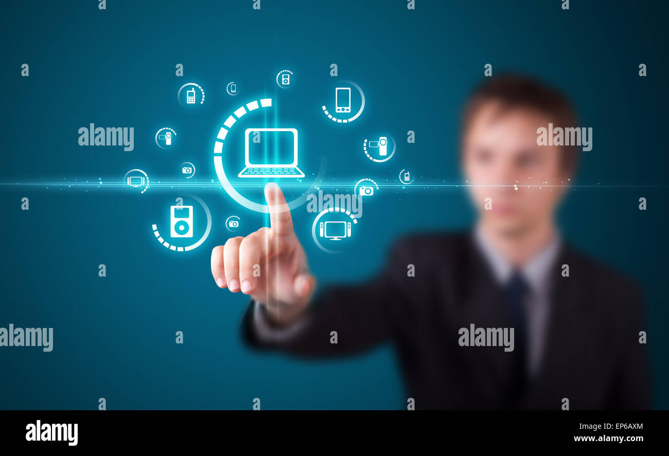 Businessman pressing virtual media type of buttons Stock Photo - Alamy