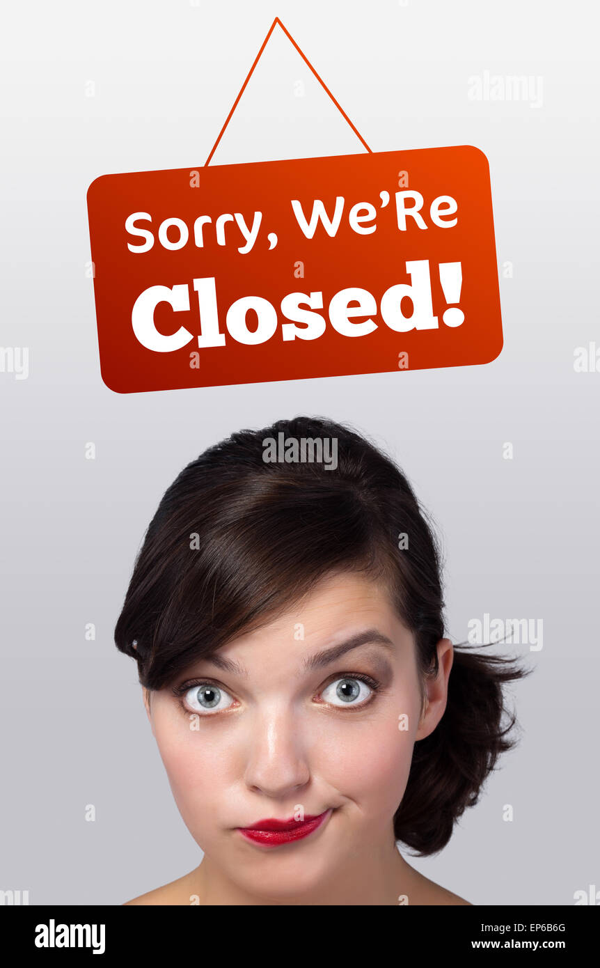 Young girl head looking at closed and open signs Stock Photo - Alamy