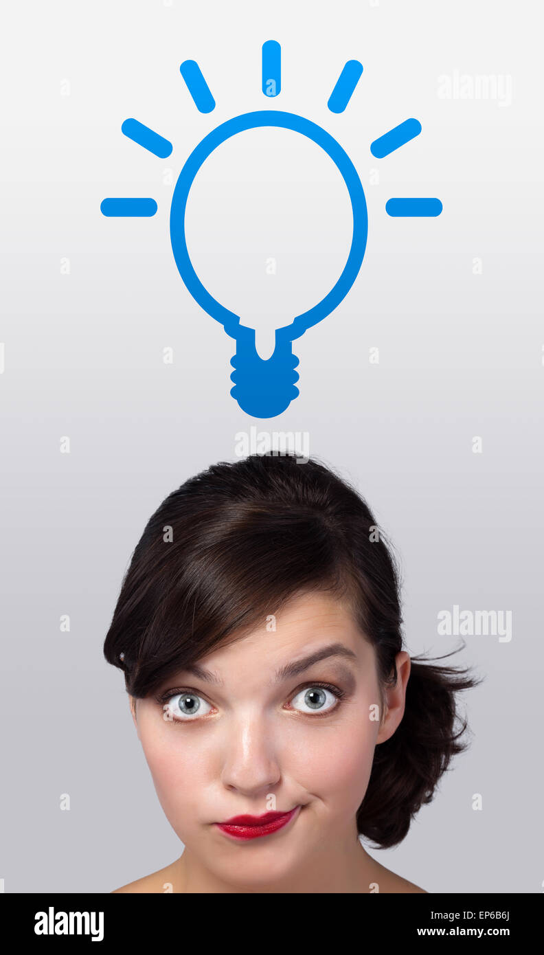 Young girl looking at idea type of sign Stock Photo - Alamy