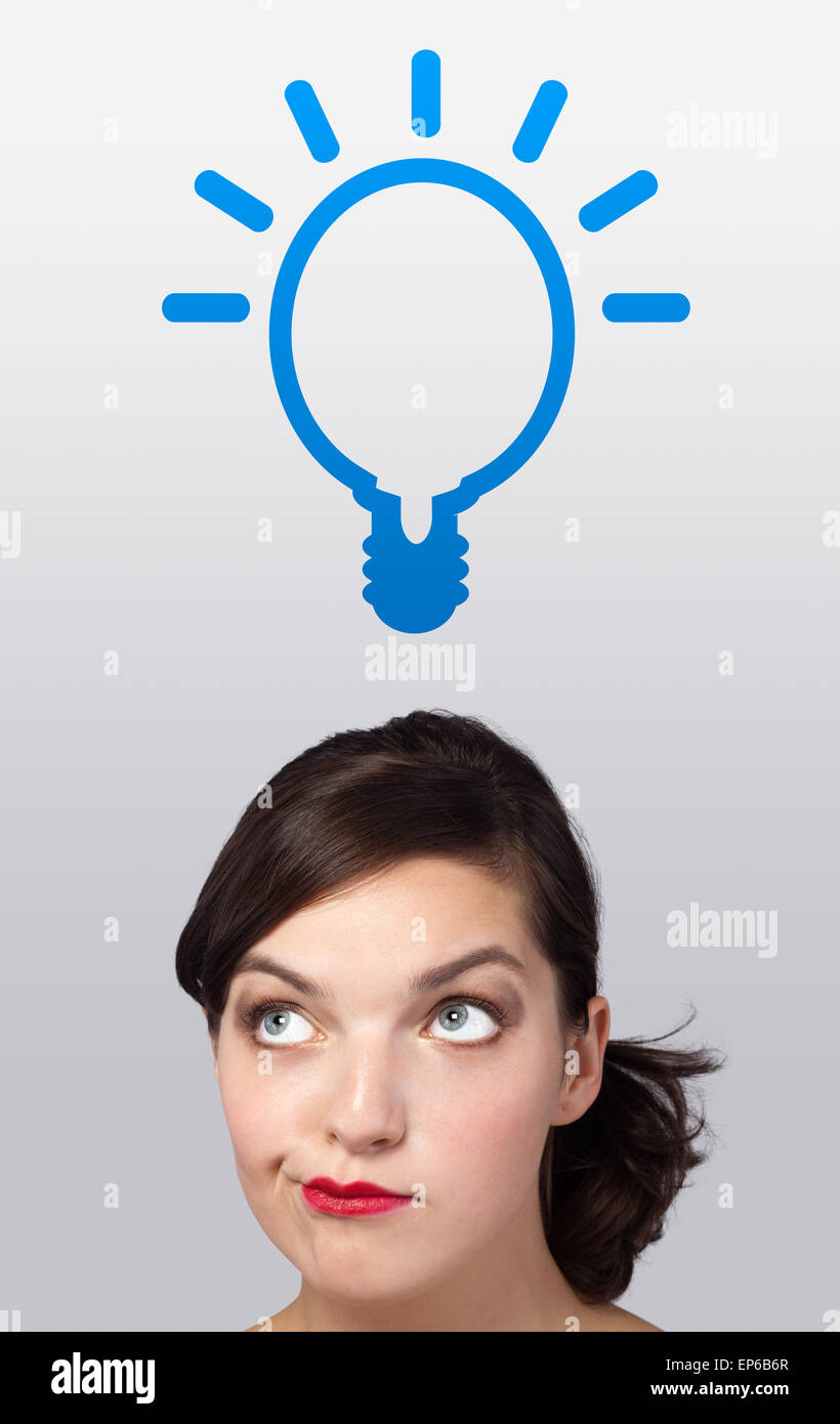 Young girl looking at idea type of sign Stock Photo - Alamy
