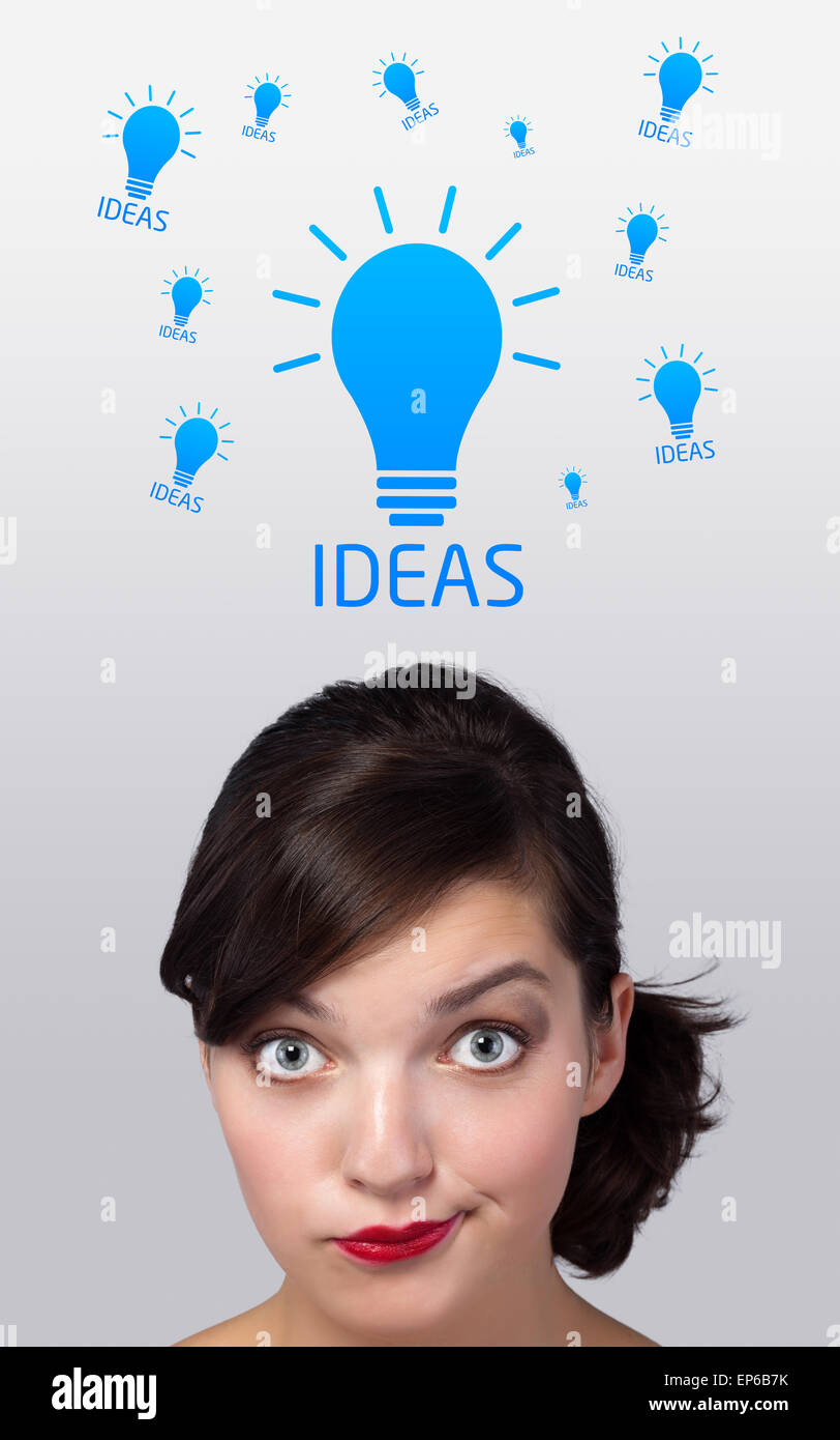 Young girl looking at idea type of sign Stock Photo - Alamy