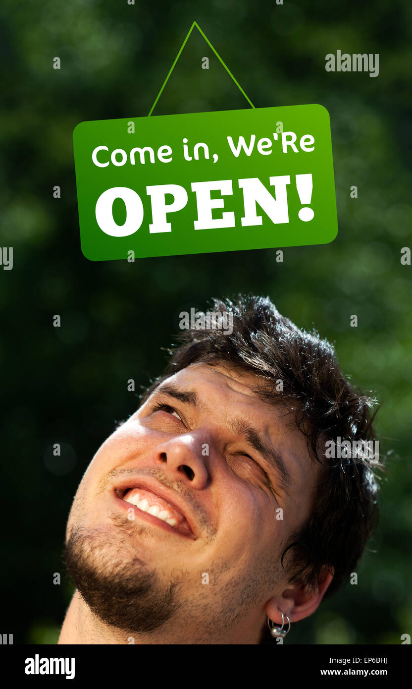 Young persons head looking at closed and open signs Stock Photo - Alamy