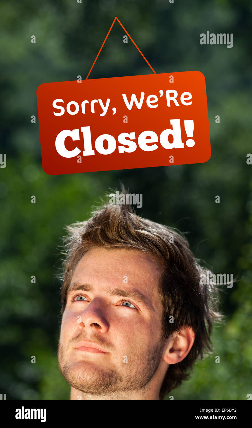 Young persons head looking at closed and open signs Stock Photo - Alamy