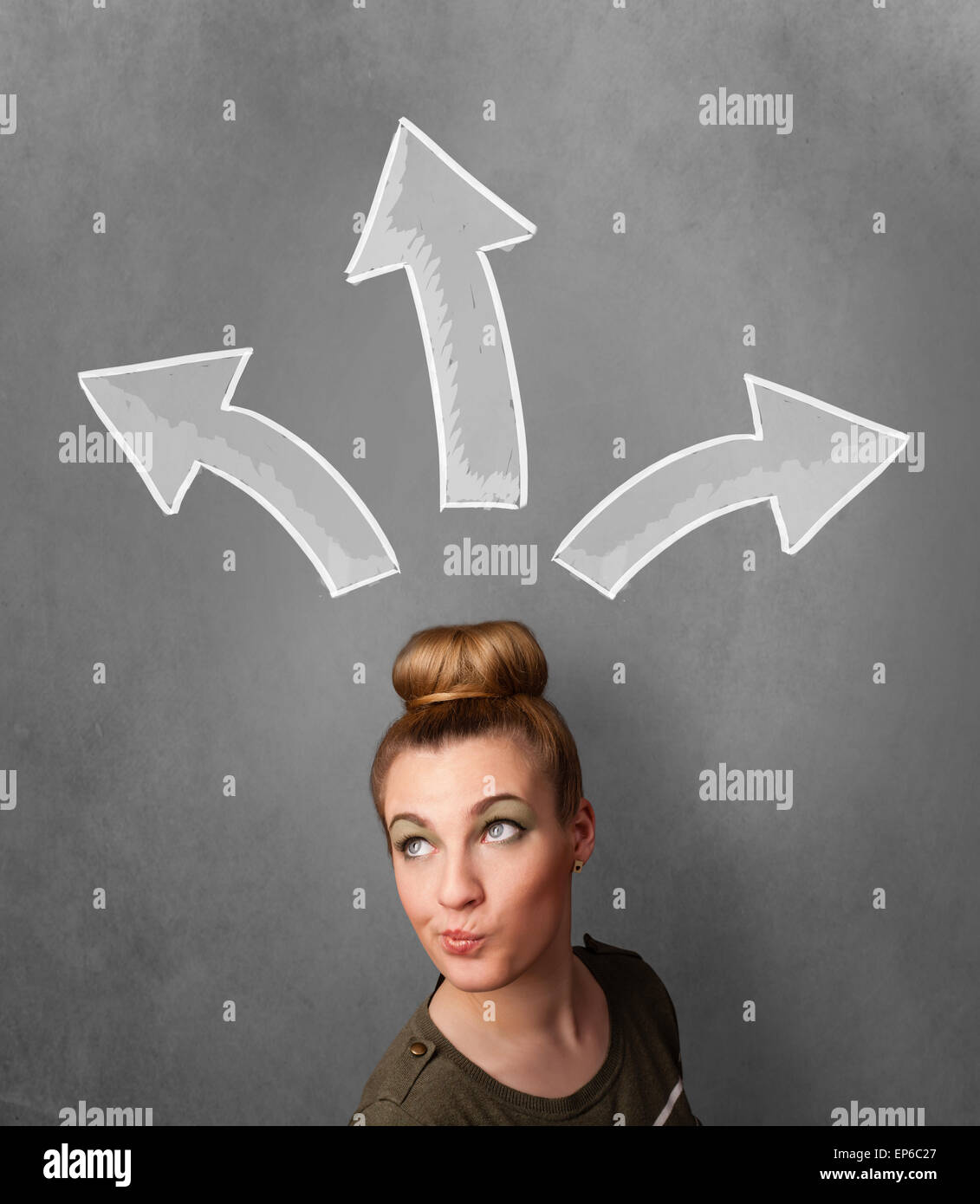 Young woman thinking with arrows above her head Stock Photo - Alamy