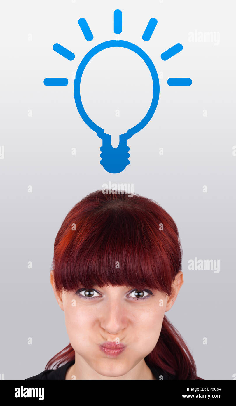 Young girl looking at idea type of sign Stock Photo - Alamy