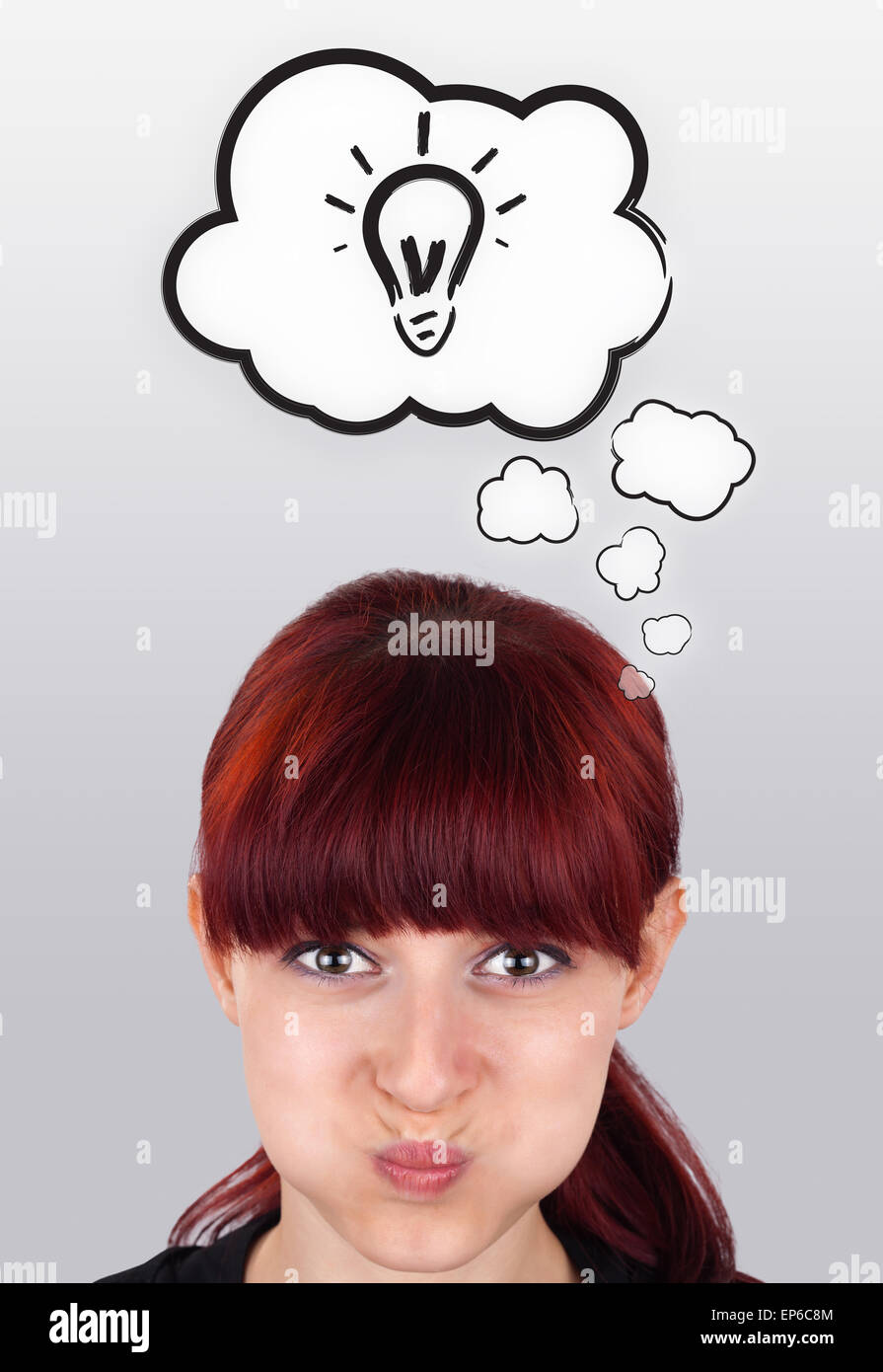 Young girl thinking with clouds Stock Photo - Alamy