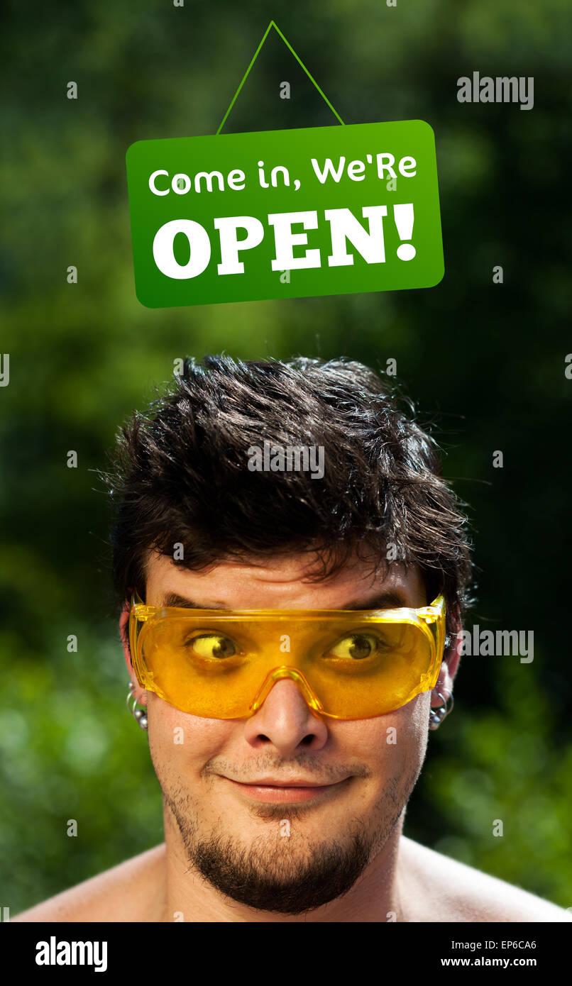 Young persons head looking at closed and open signs Stock Photo - Alamy