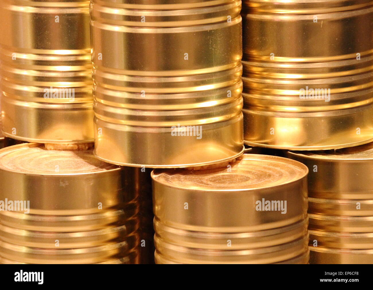 Golden metal cans with line cut closeup Stock Photo - Alamy