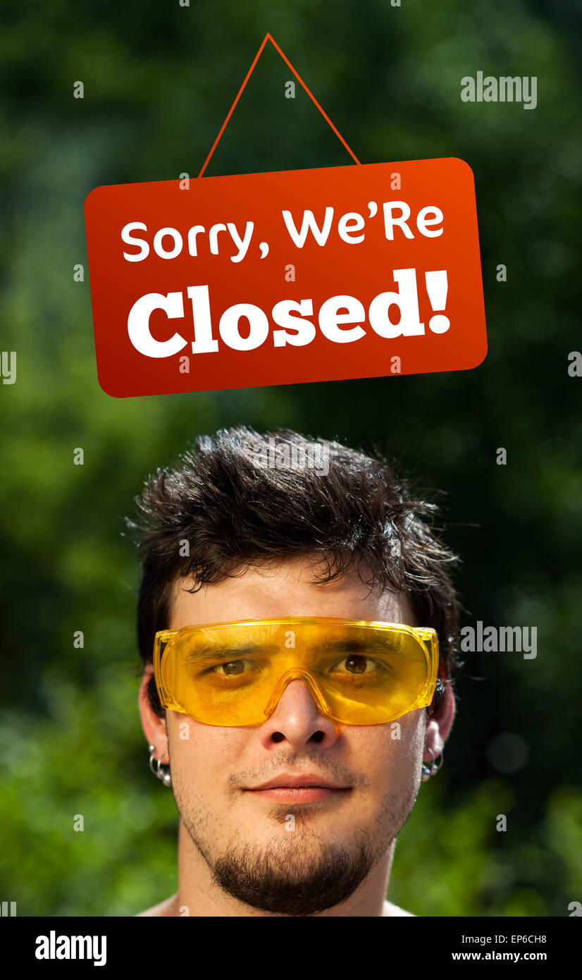 Young persons head looking at closed and open signs Stock Photo - Alamy