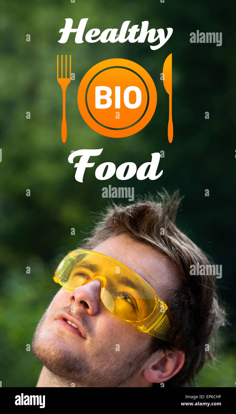 Young head looking at healthy food sign Stock Photo - Alamy