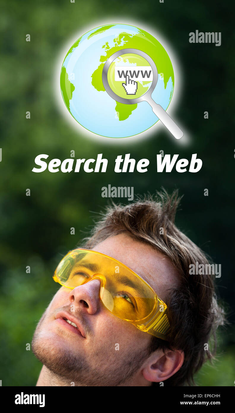 Young head looking at internet type of icons Stock Photo - Alamy