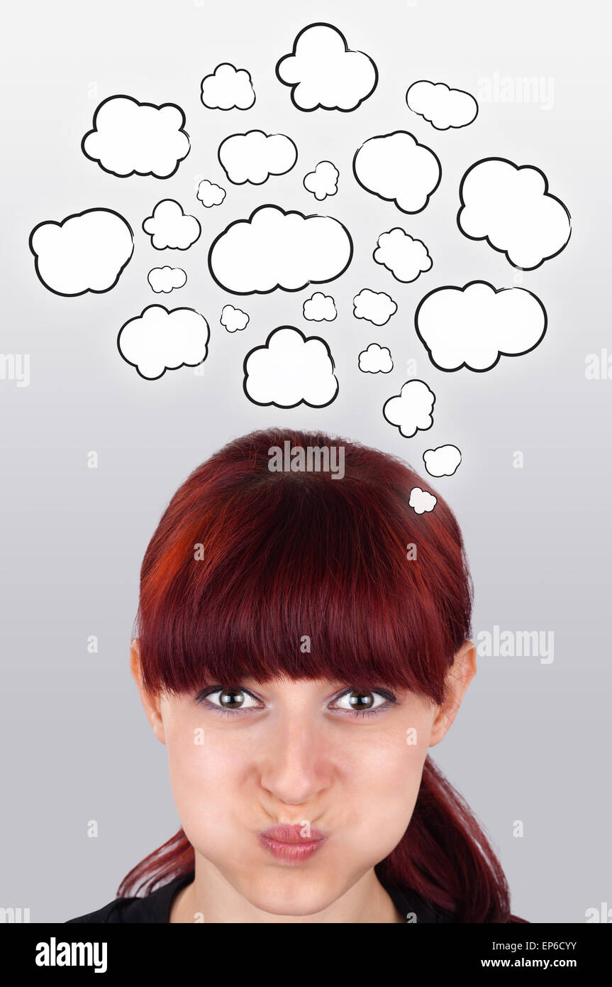 Young girl thinking with clouds Stock Photo - Alamy