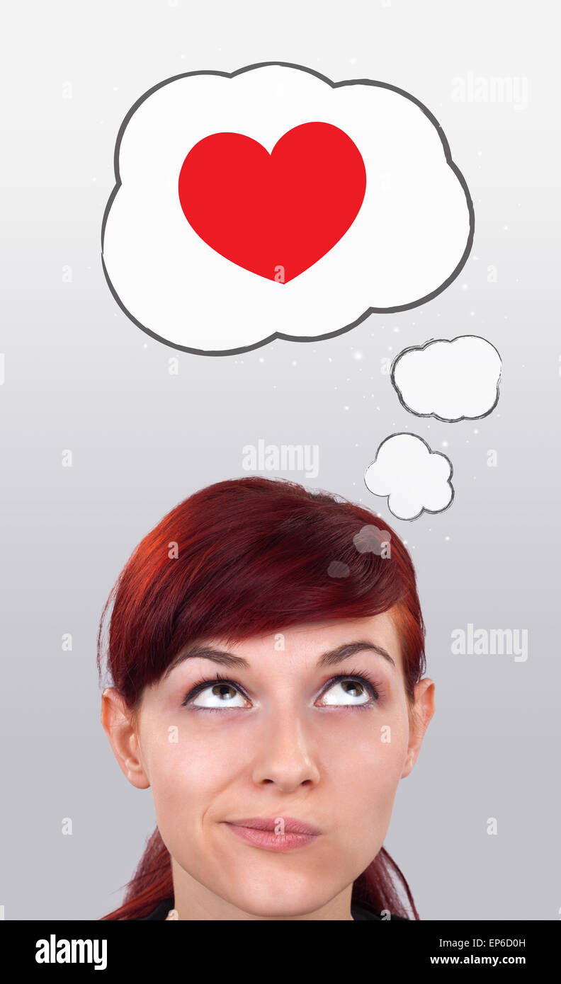 Young girl looking at love type of icons Stock Photo - Alamy