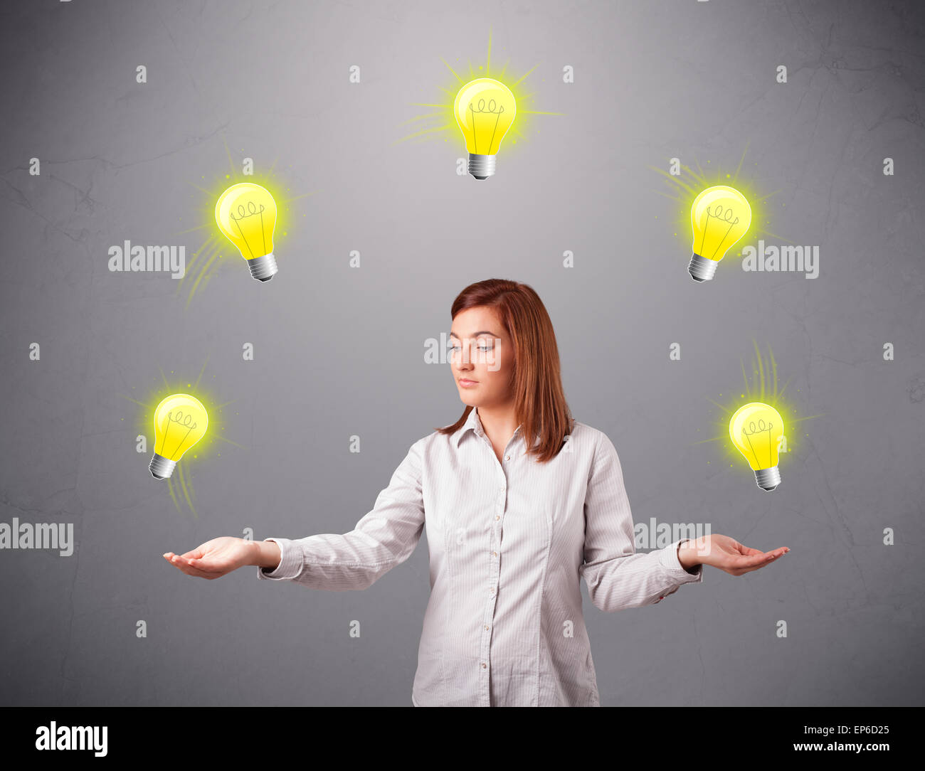 young lady standing and juggling with light bulbs Stock Photo - Alamy