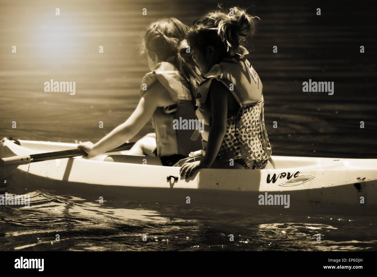 2 girls kayaking on the river Stock Photo - Alamy