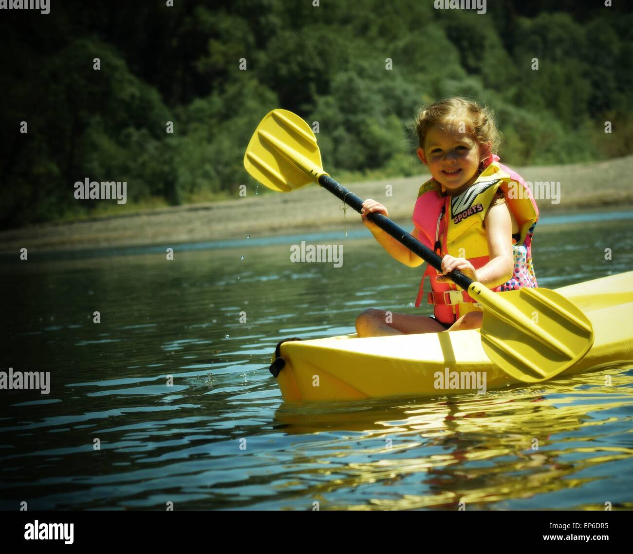 Young girl kayaking on the river Stock Photo - Alamy