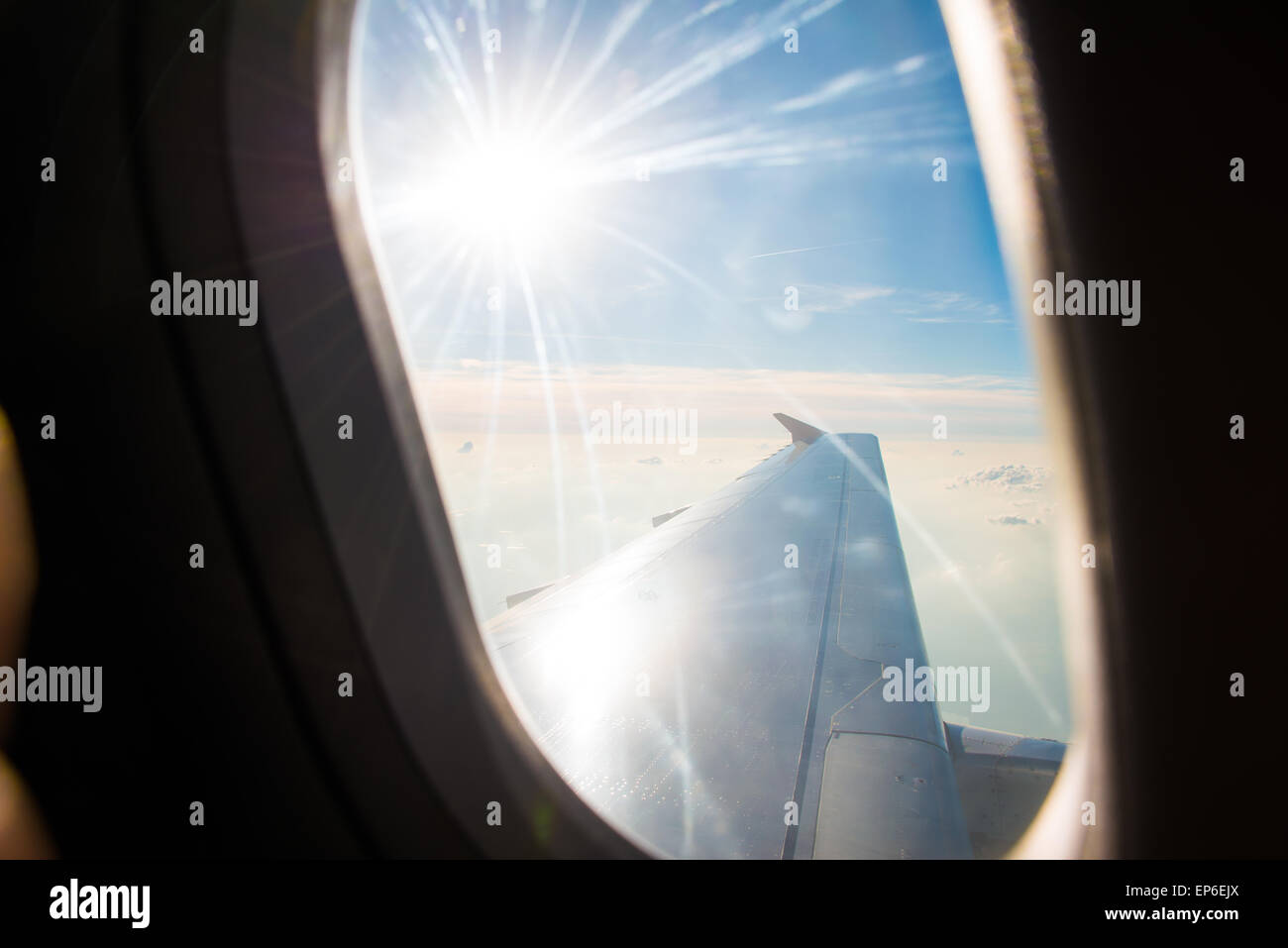 Airplane wing out of window Stock Photo - Alamy