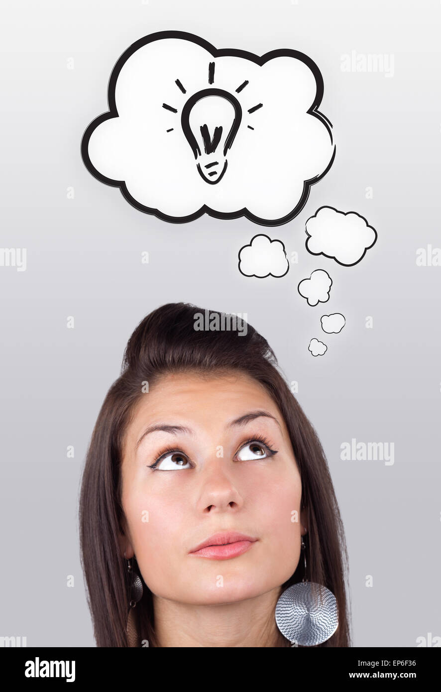 Young girl thinking with clouds Stock Photo - Alamy