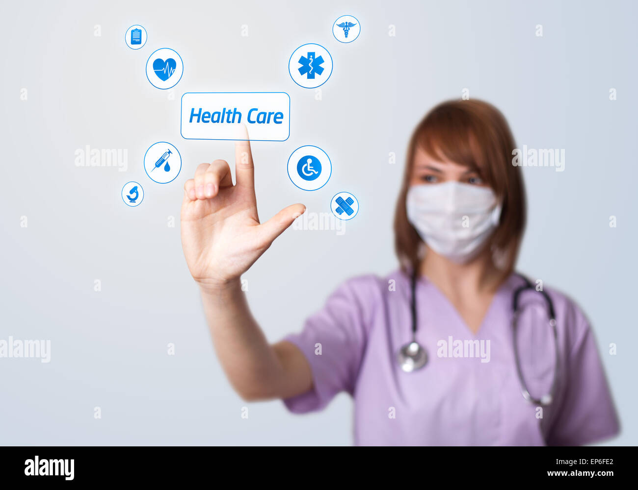 Woman doctor pressing digital button Stock Photo - Alamy