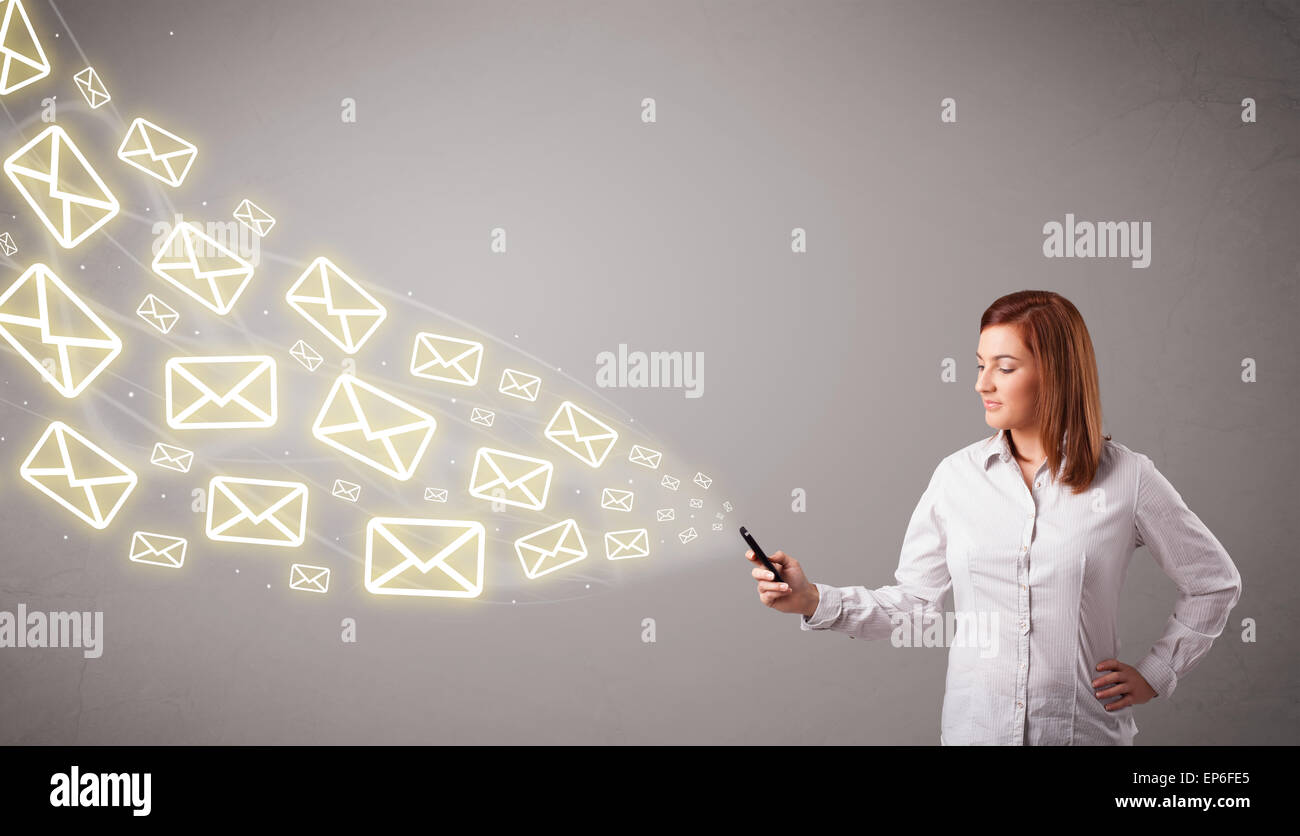 attractive young lady holding a phone with message icons Stock Photo ...