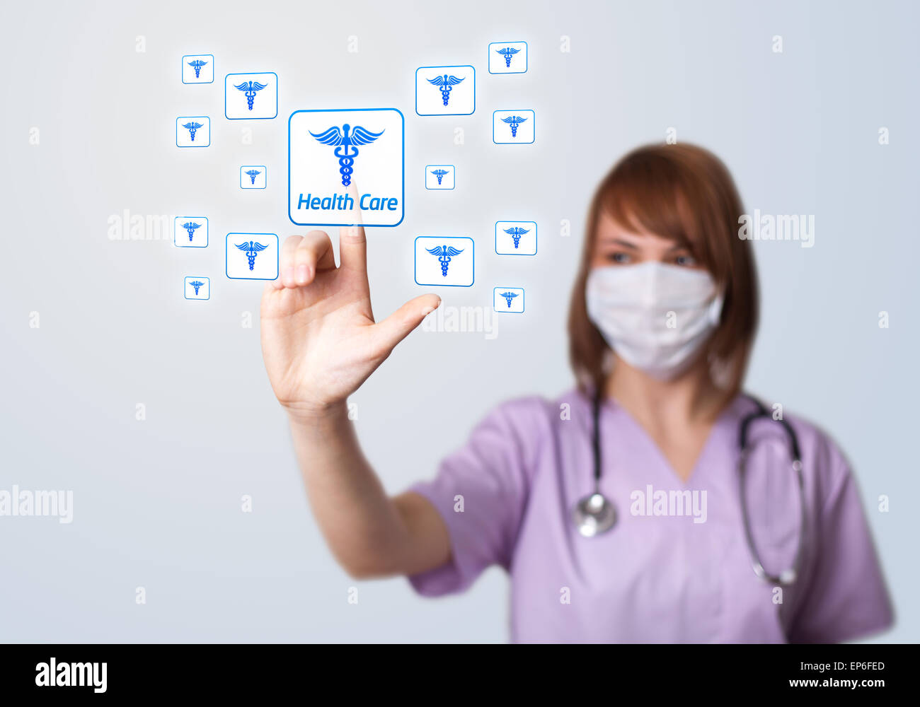 Woman doctor pressing digital button Stock Photo - Alamy