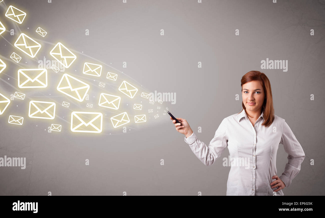 attractive young lady holding a phone with message icons Stock Photo ...