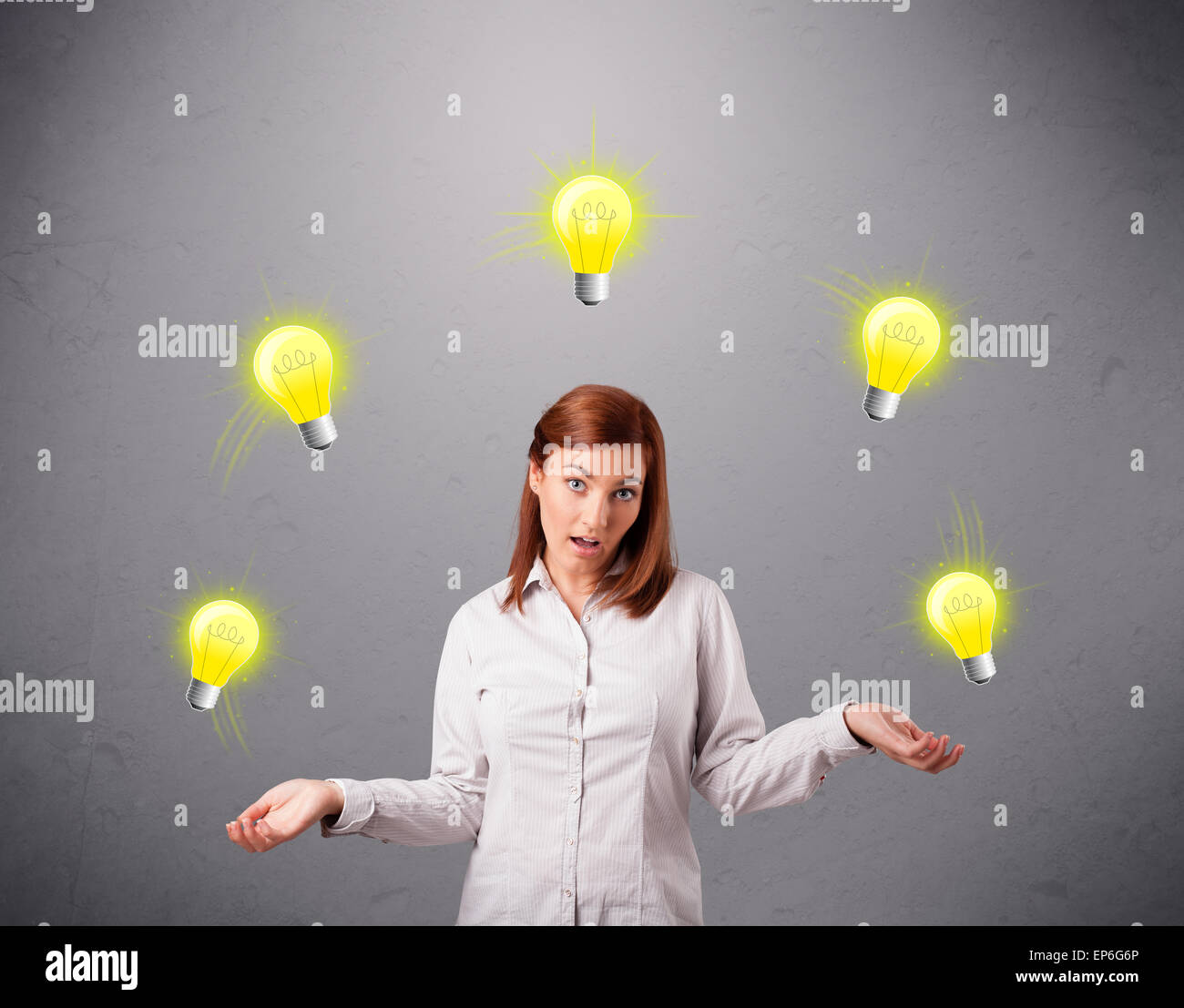 young lady standing and juggling with light bulbs Stock Photo - Alamy