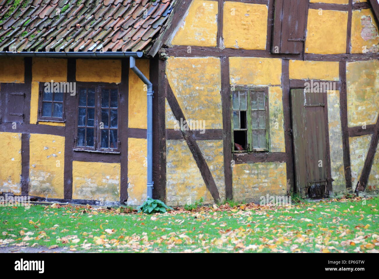 Old worn half-timbered cottage house with broken window Stock Photo - Alamy