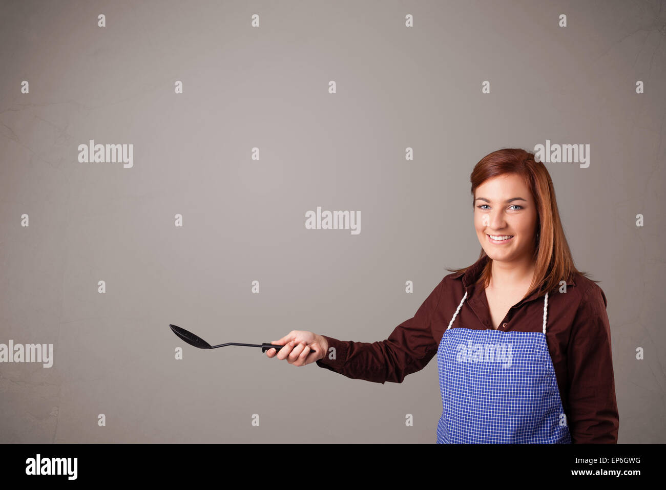 Pretty woman holding a spoon Stock Photo - Alamy