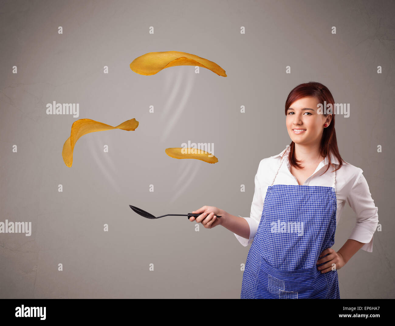 Woman making pancakes Stock Photo - Alamy
