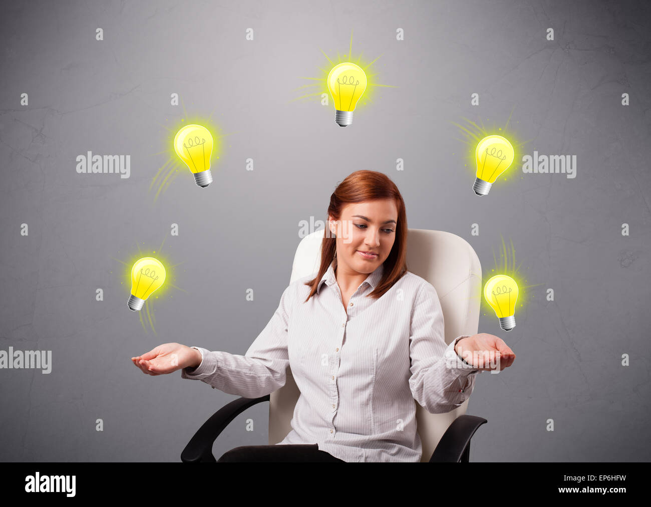 young lady sitting and juggling with light bulbs Stock Photo - Alamy