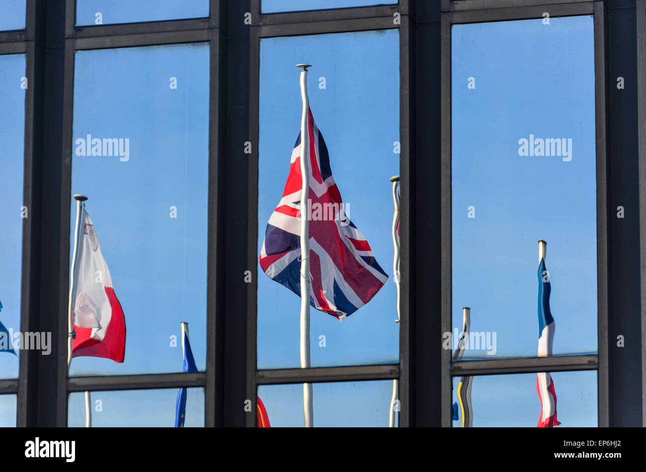 Union Jack and flags of the European Union countries reflecting on the ...