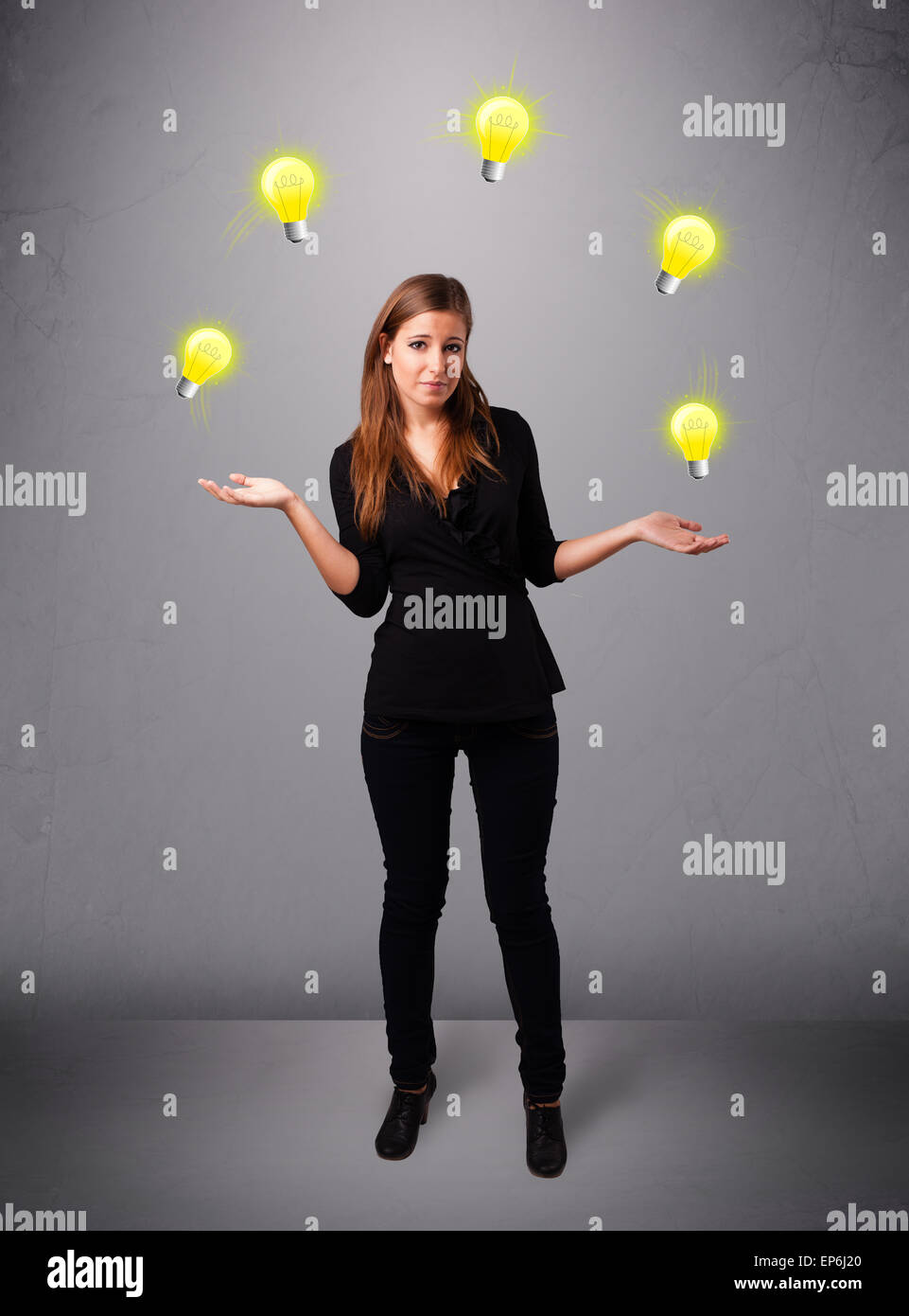 young lady standing and juggling with light bulbs Stock Photo - Alamy