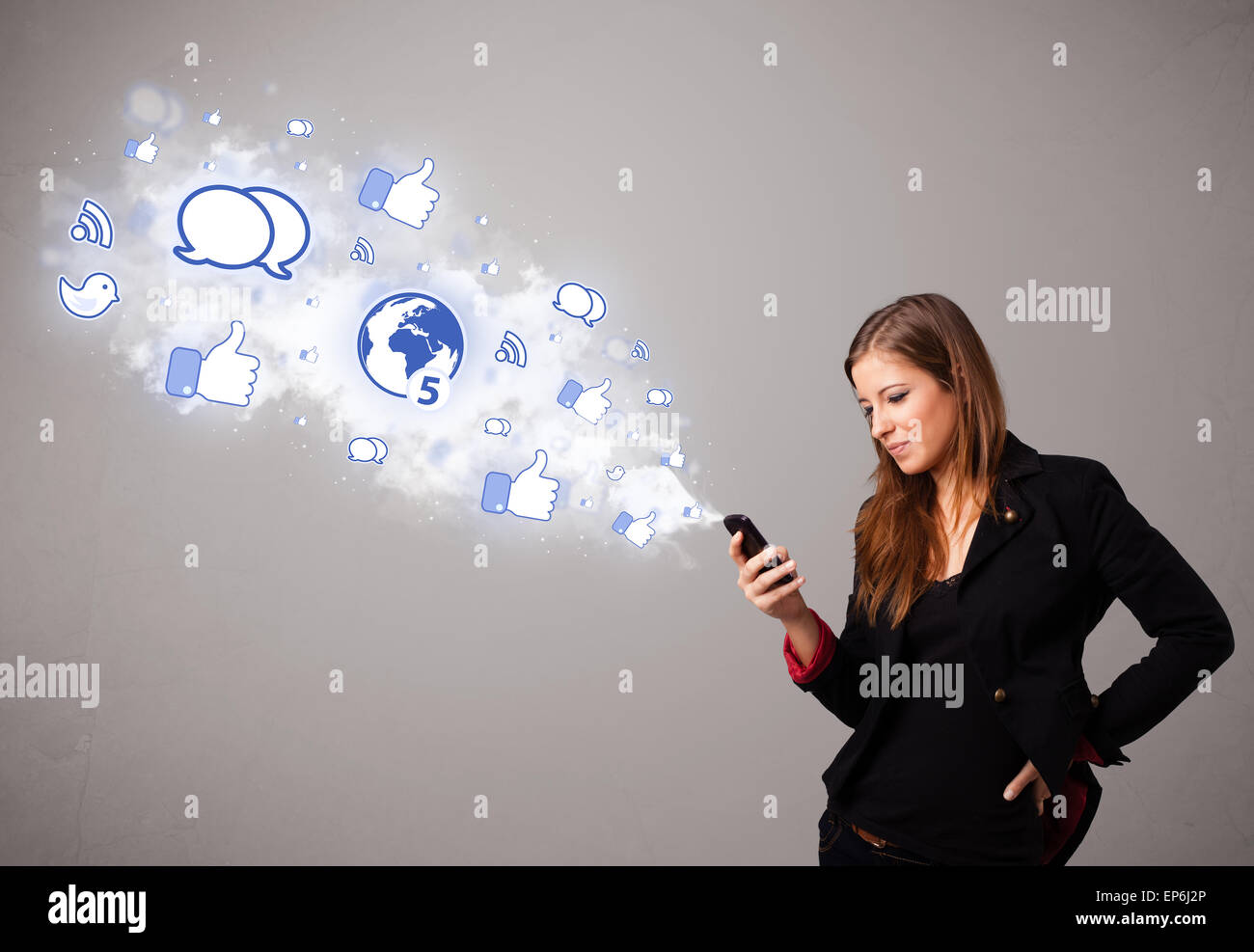 Pretty young girl holding a phone with social media icons Stock Photo ...