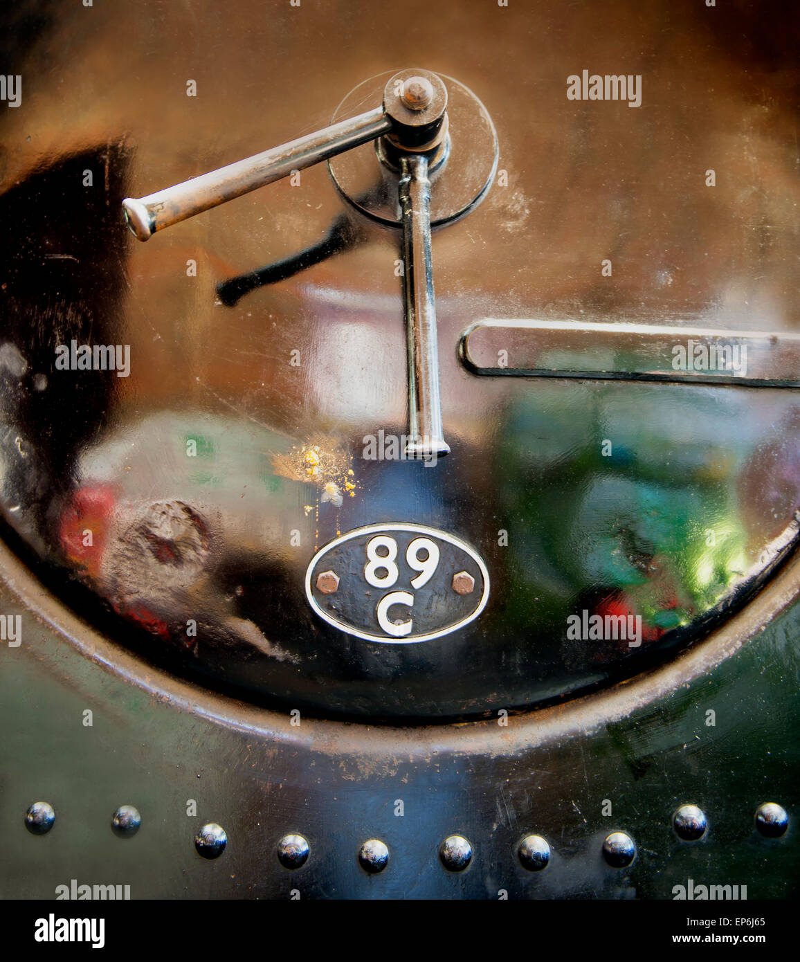 Front of railway steam engine boiler door Stock Photo - Alamy