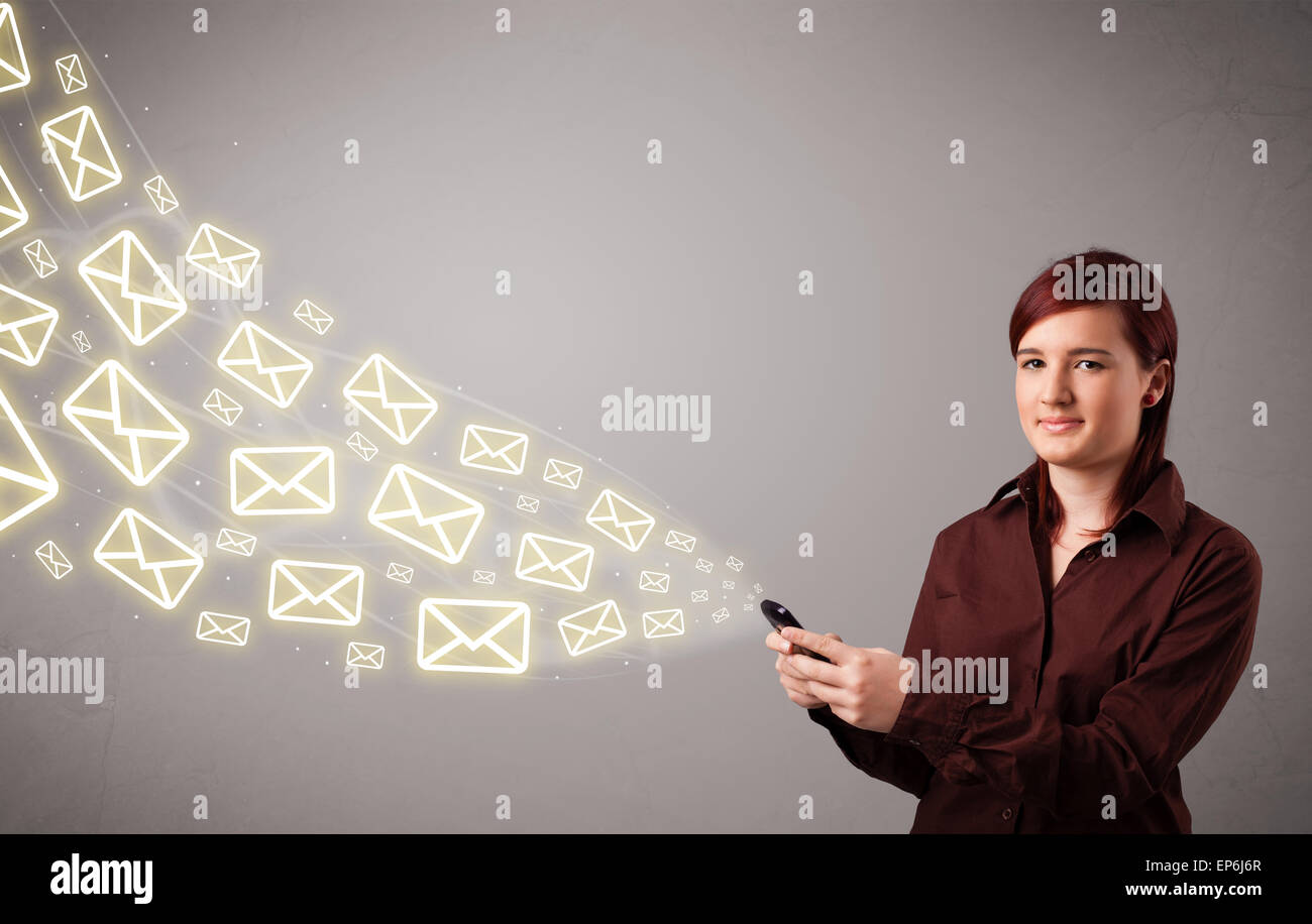 attractive young lady holding a phone with message icons Stock Photo ...
